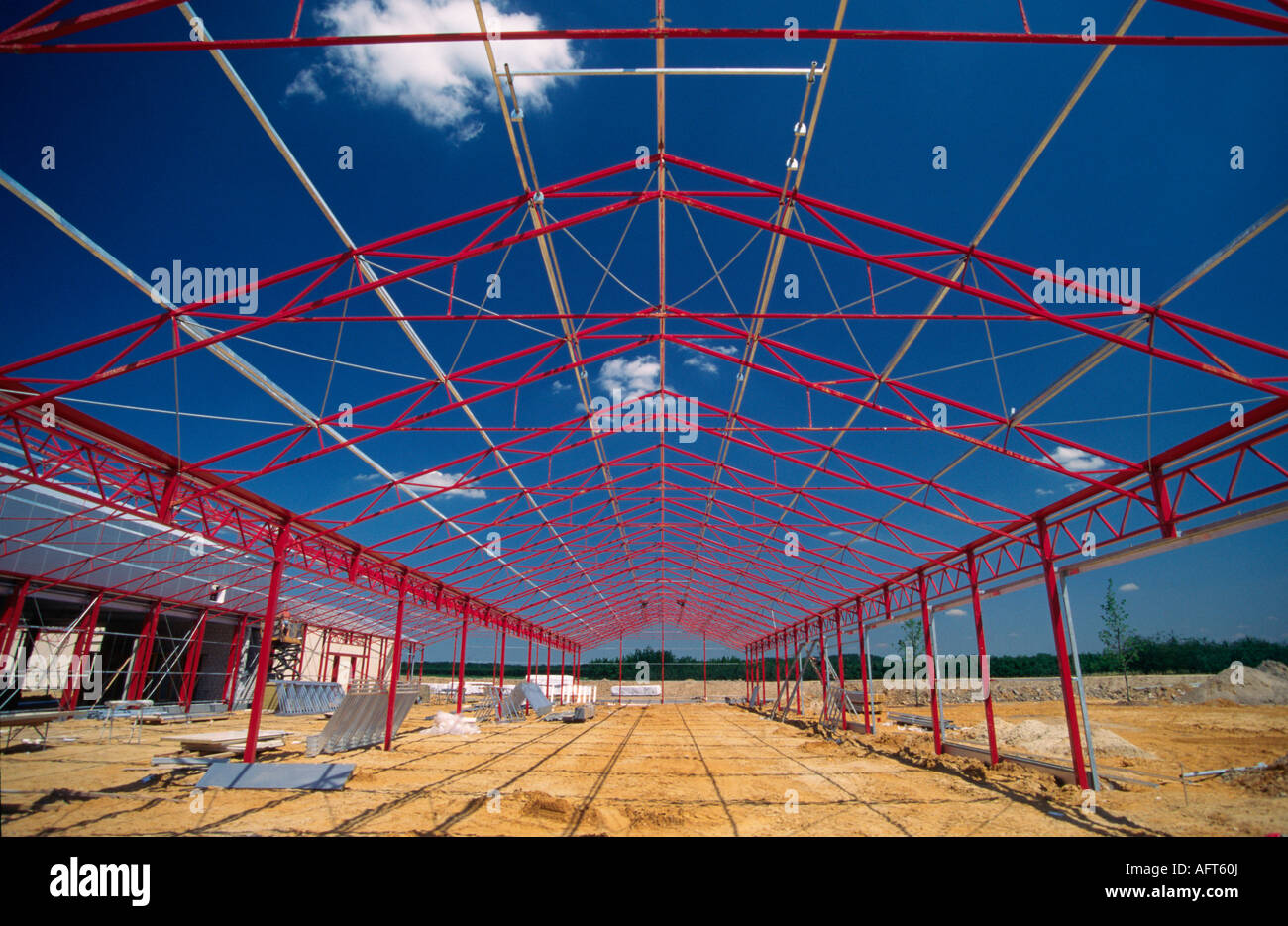 building site with red framework of warehouse being built Stock Photo ...