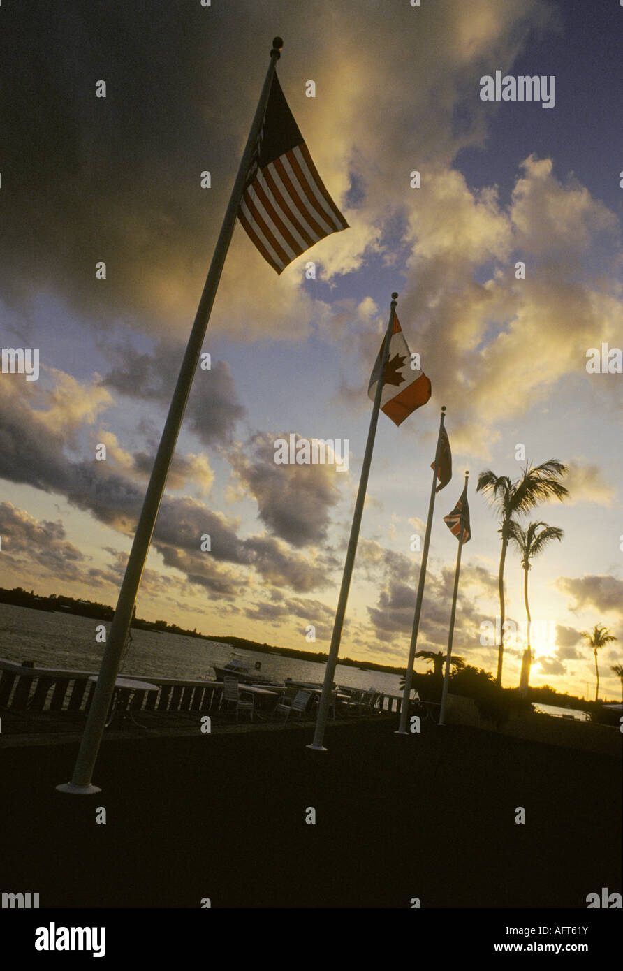 sunset flags palm trees boats clouds Hamilton Bermuda Stock Photo - Alamy