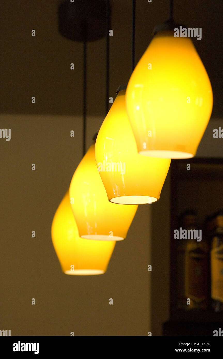 Four indoor lamps grouped together in a coffee shop Stock Photo - Alamy