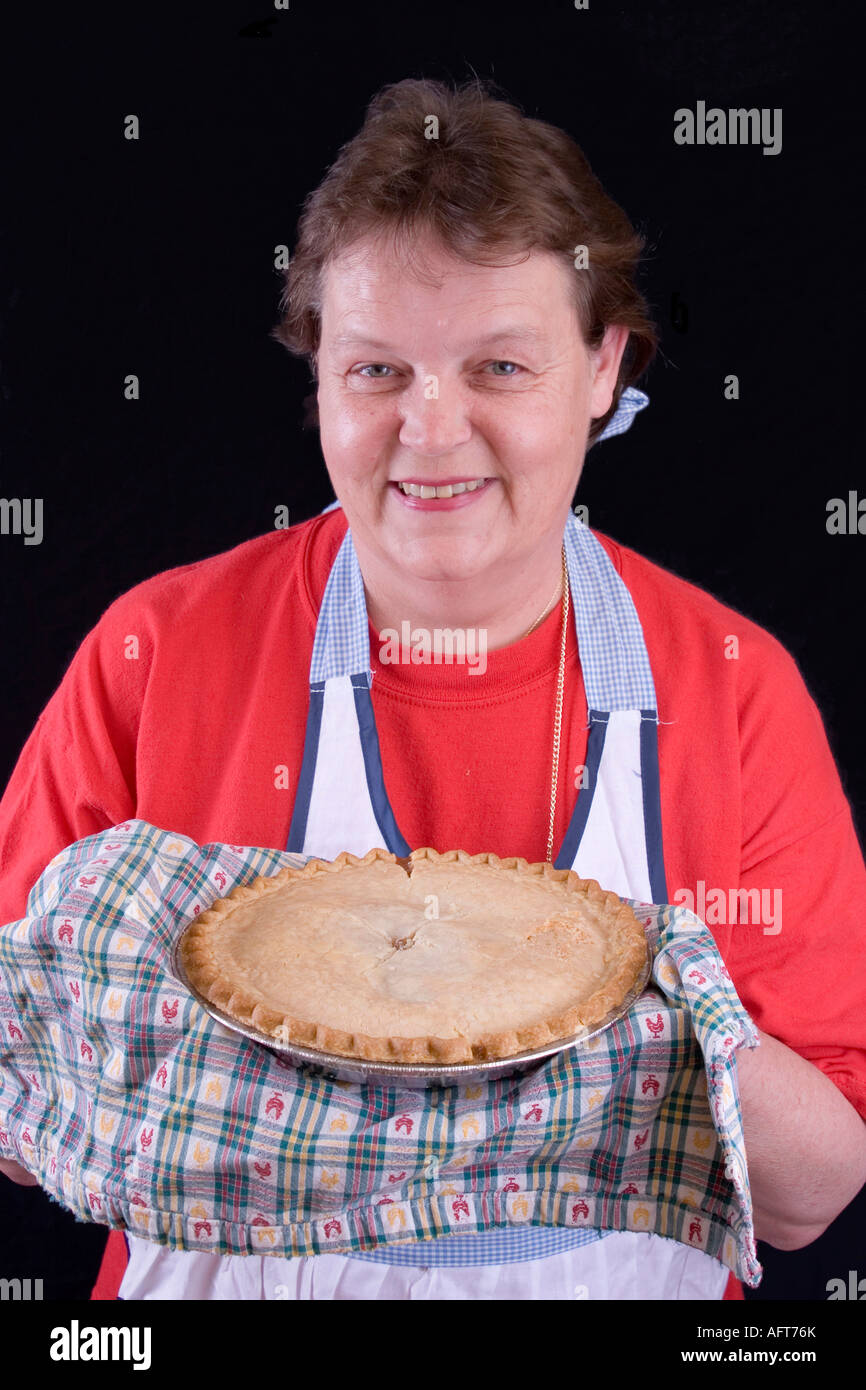 Older woman holding a pie Stock Photo - Alamy