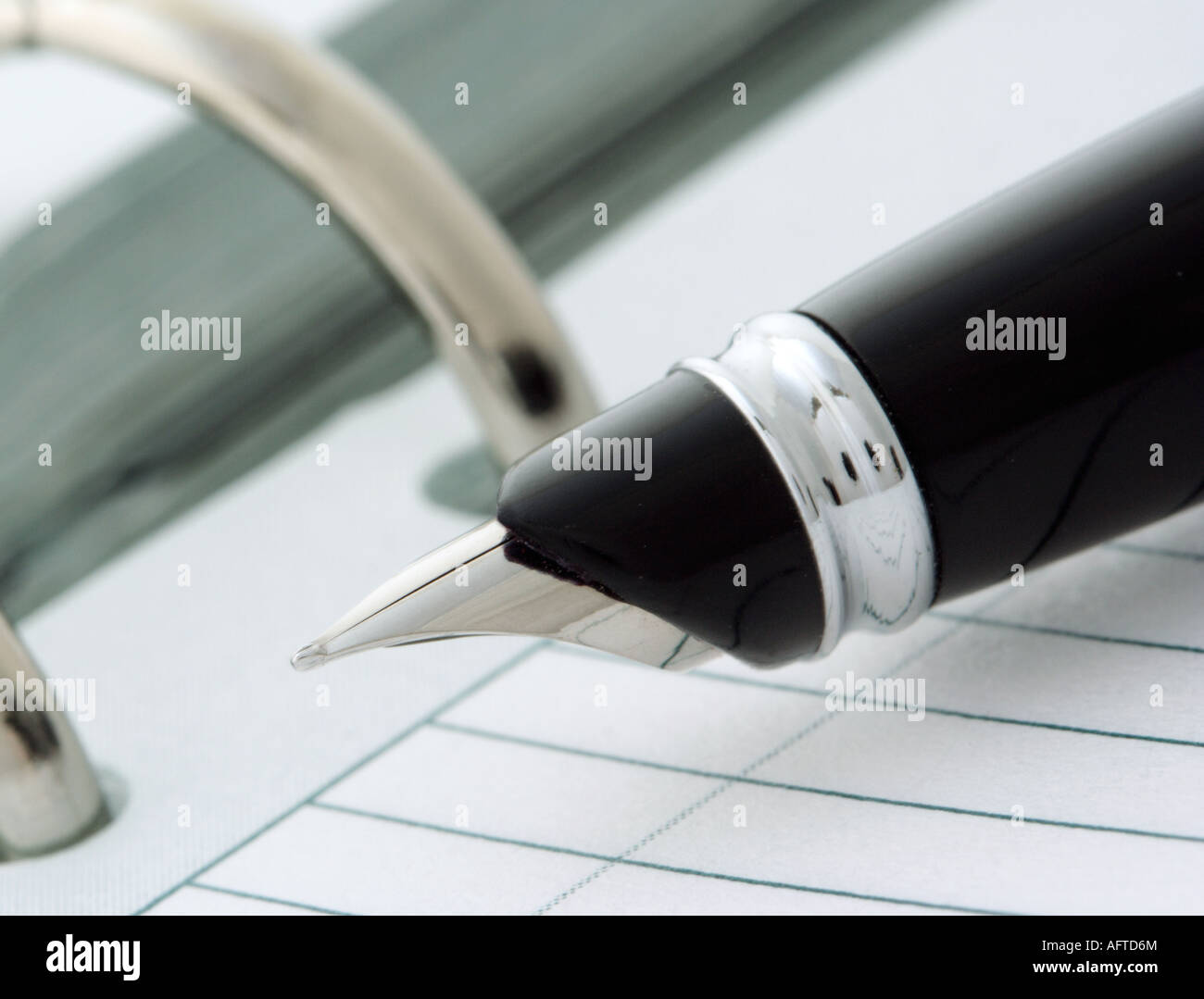 Pen on notebook Stock Photo - Alamy