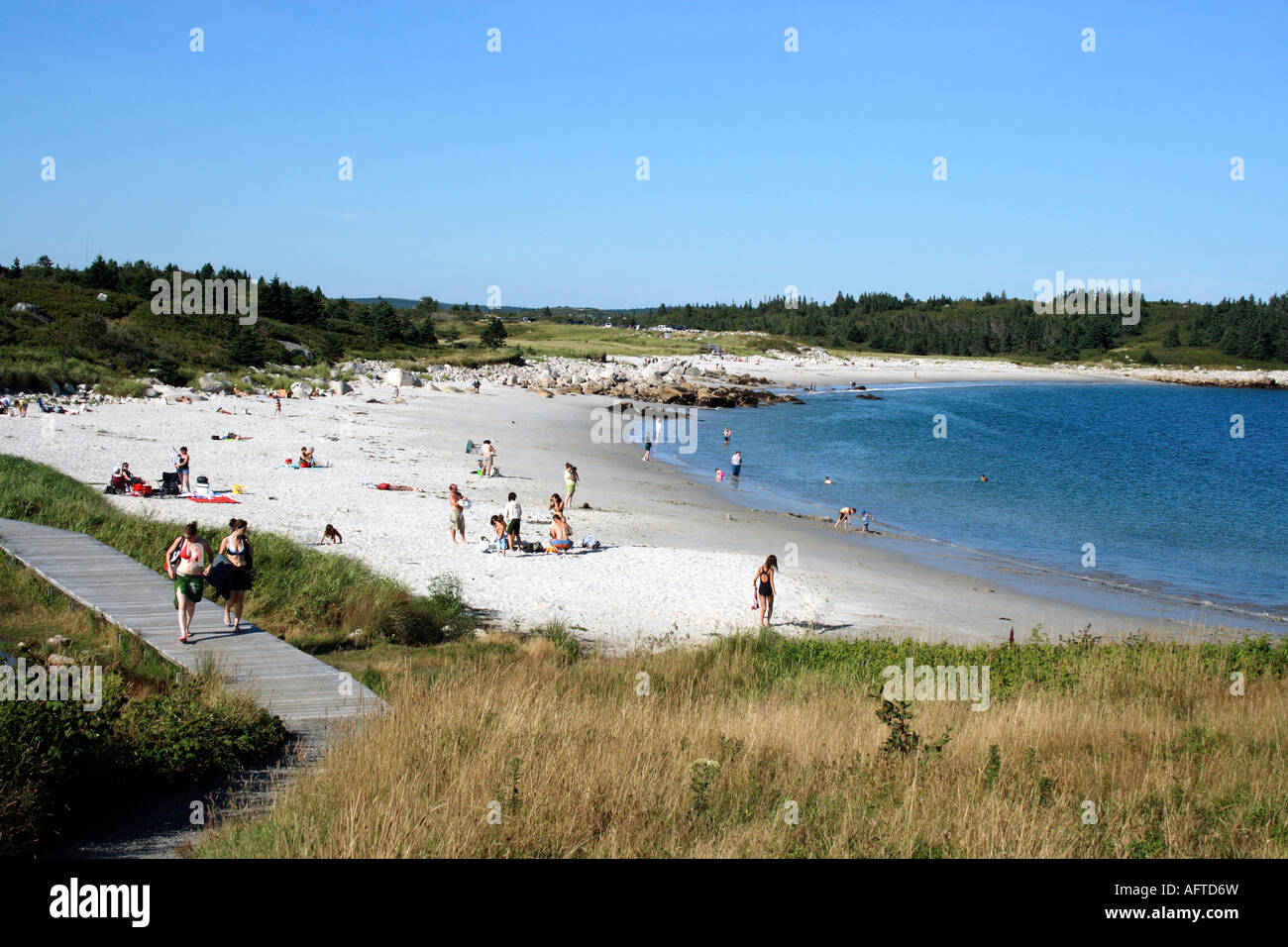 relaxing on the sandy beach of Crystal Crescent Beach, Halifax, Nova ...