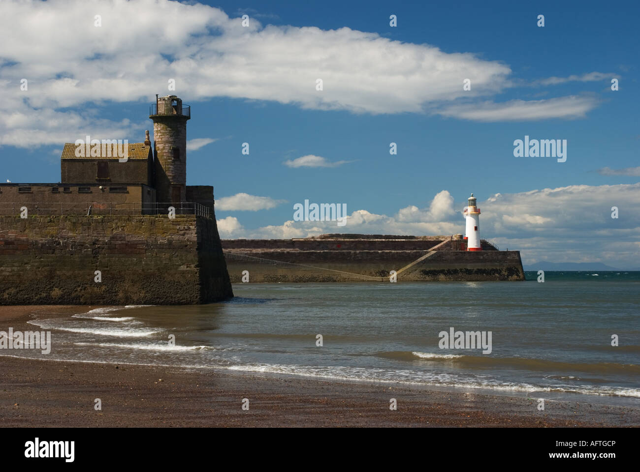 Harbour walls and lighthouse in Whitehaven, Cumbria, UK Stock Photo - Alamy