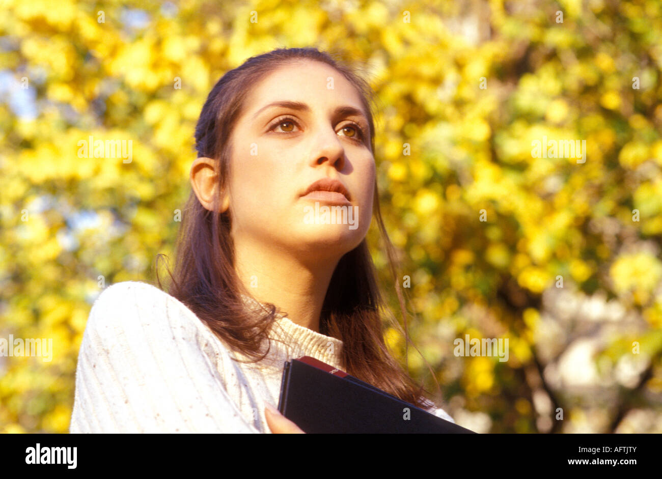 Smiling polite woman standing hi-res stock photography and images - Alamy