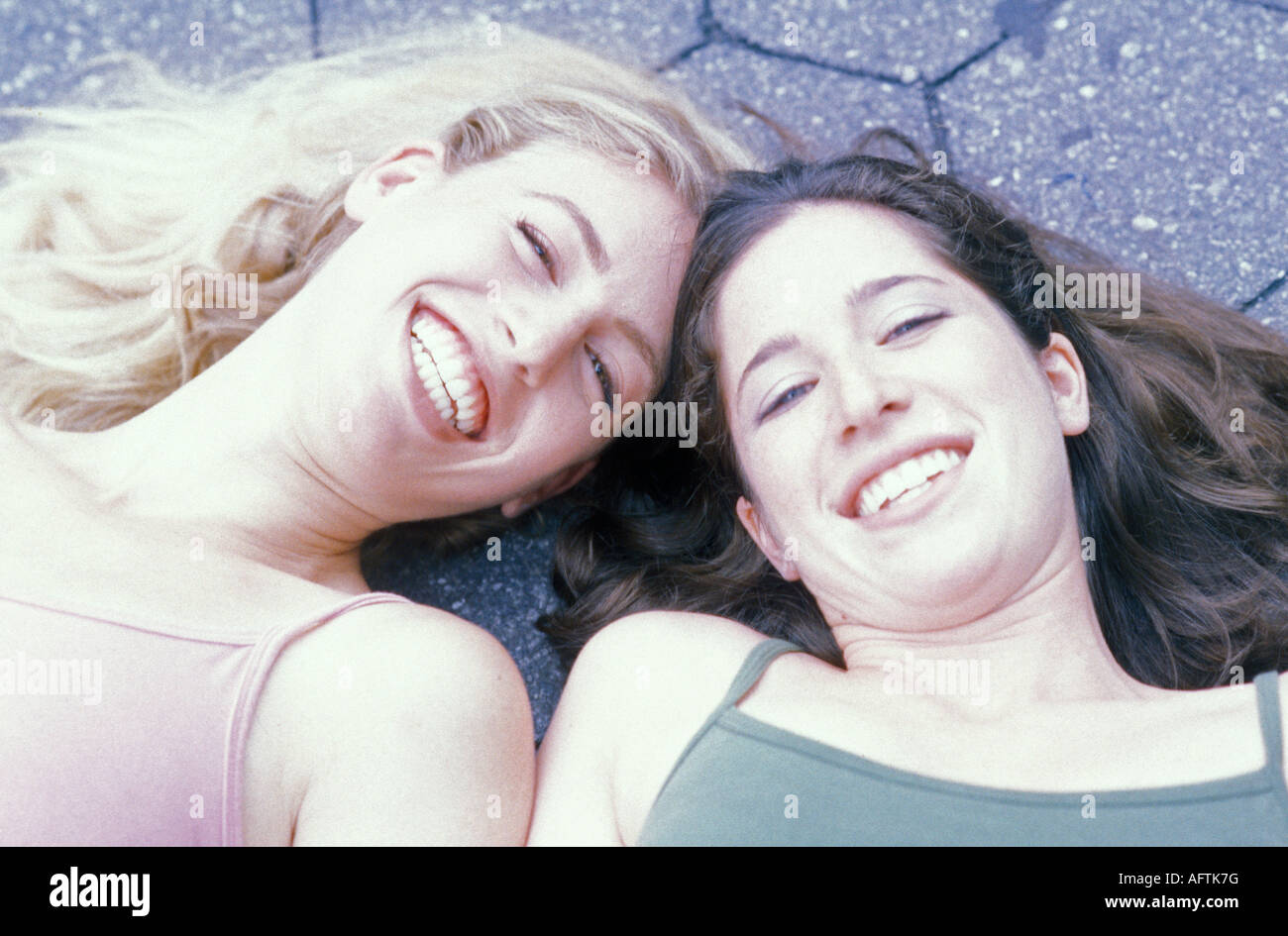 Young women embracing, smiling, portrait Stock Photo - Alamy