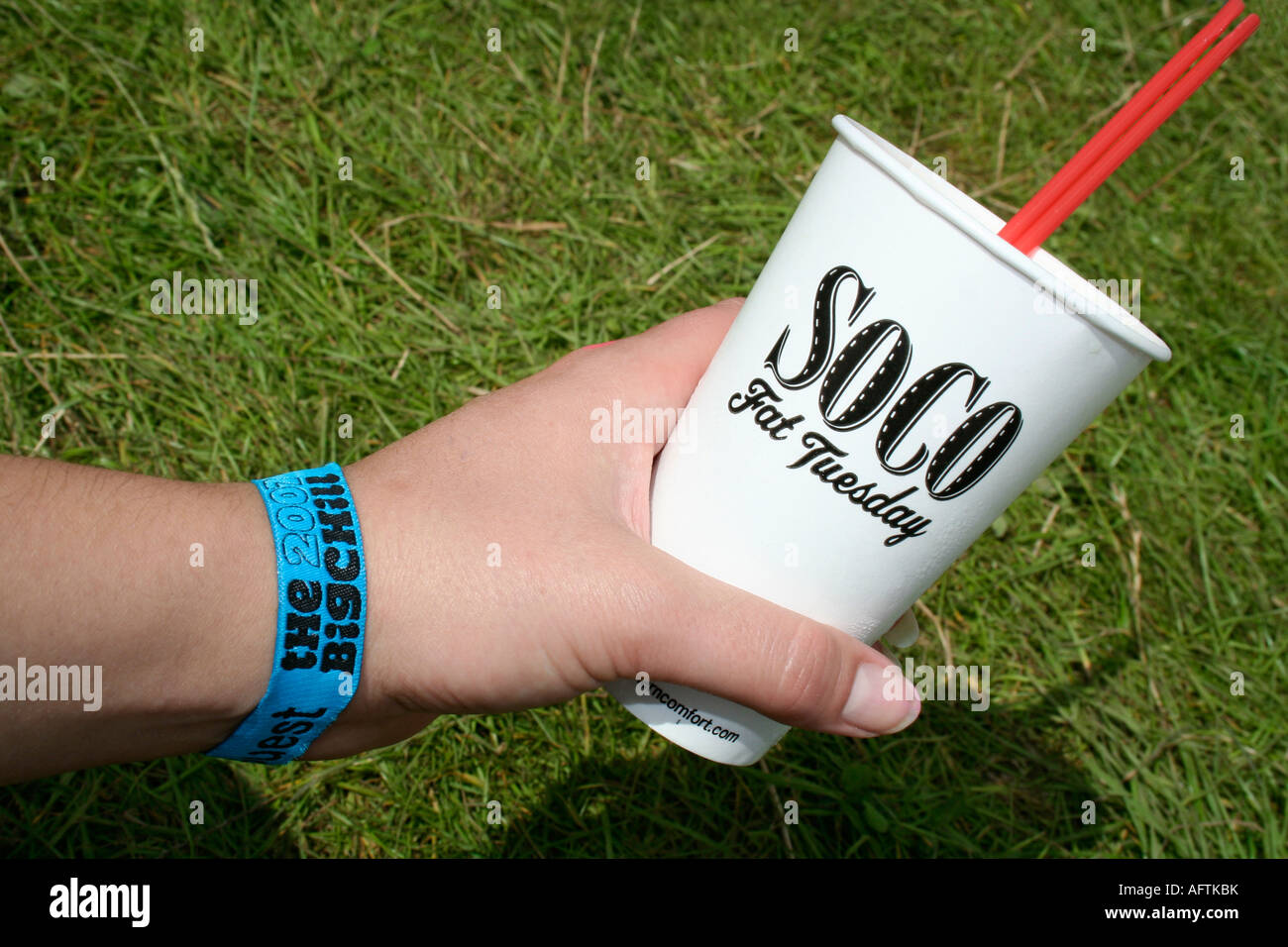 The big chill music festival arm band holding soco paper cup Stock ...