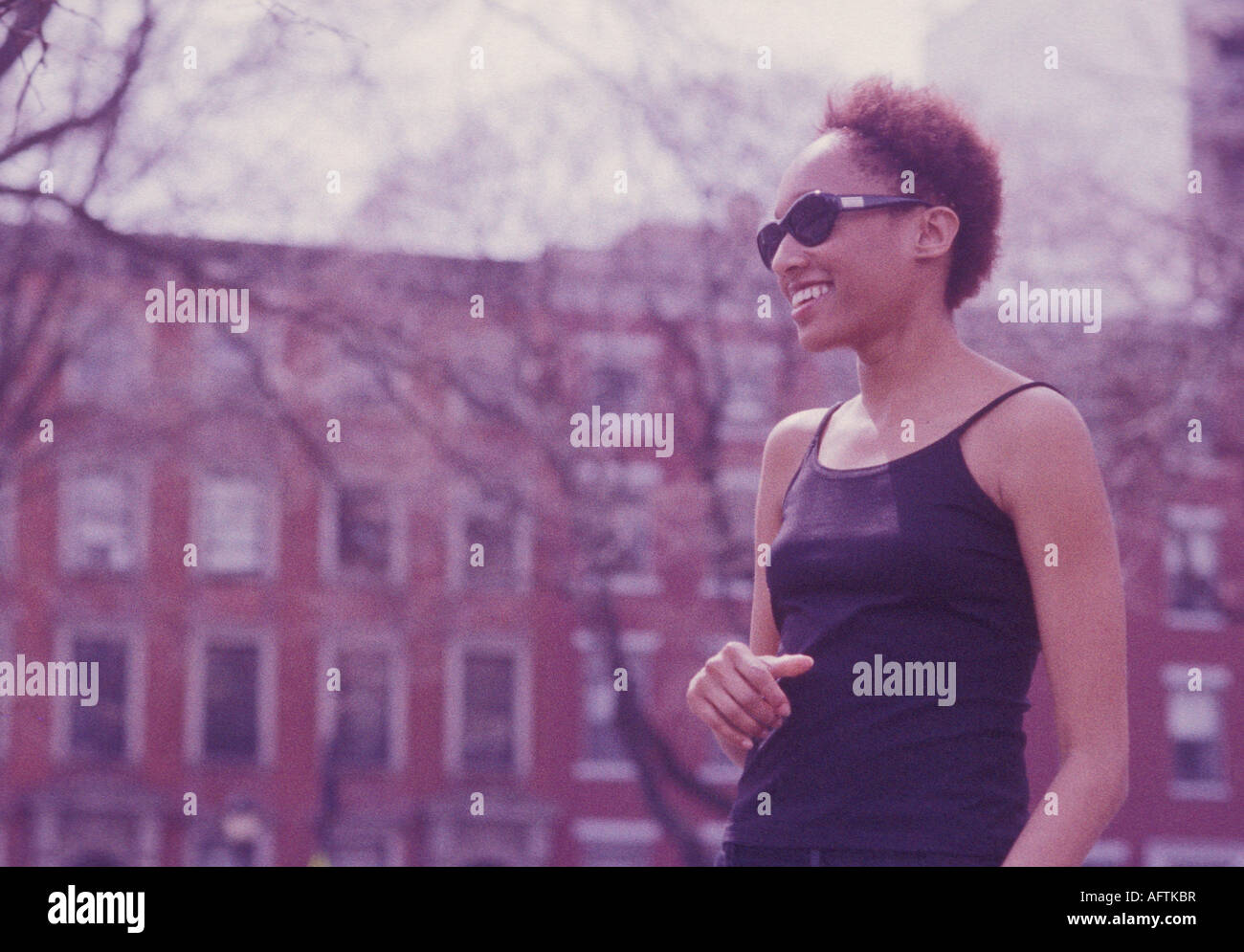 Woman exulting in park Stock Photo - Alamy