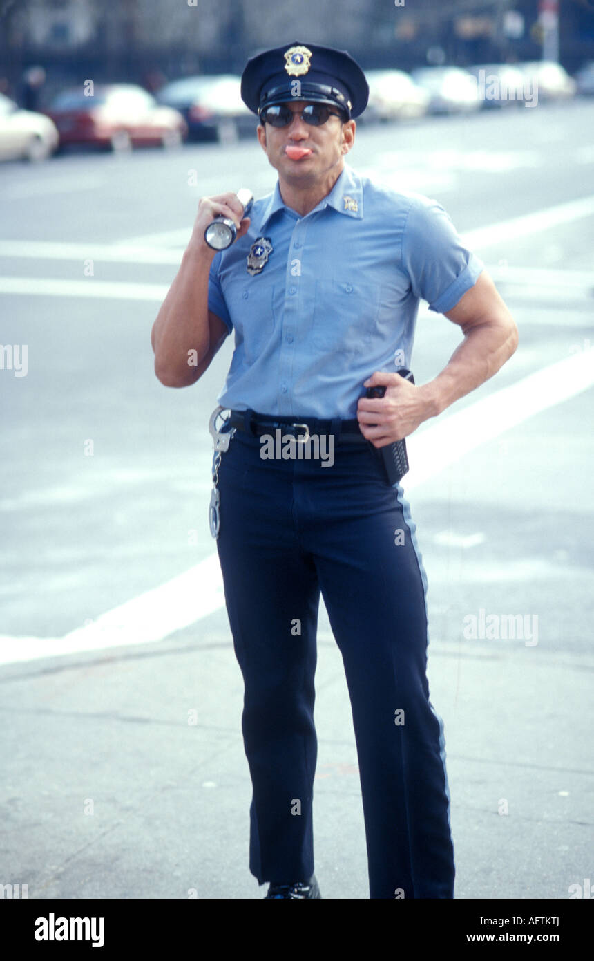 Police officer blowing gum Stock Photo - Alamy
