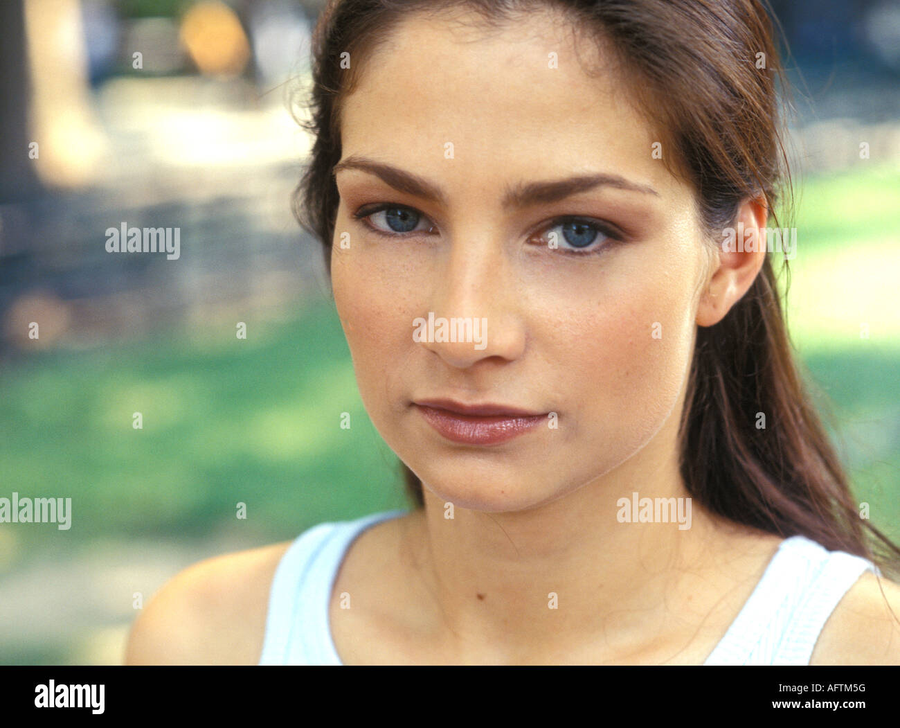 Young woman smiling, side view Stock Photo - Alamy