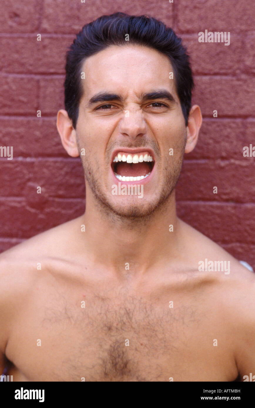 Young man yelling, portrait Stock Photo - Alamy