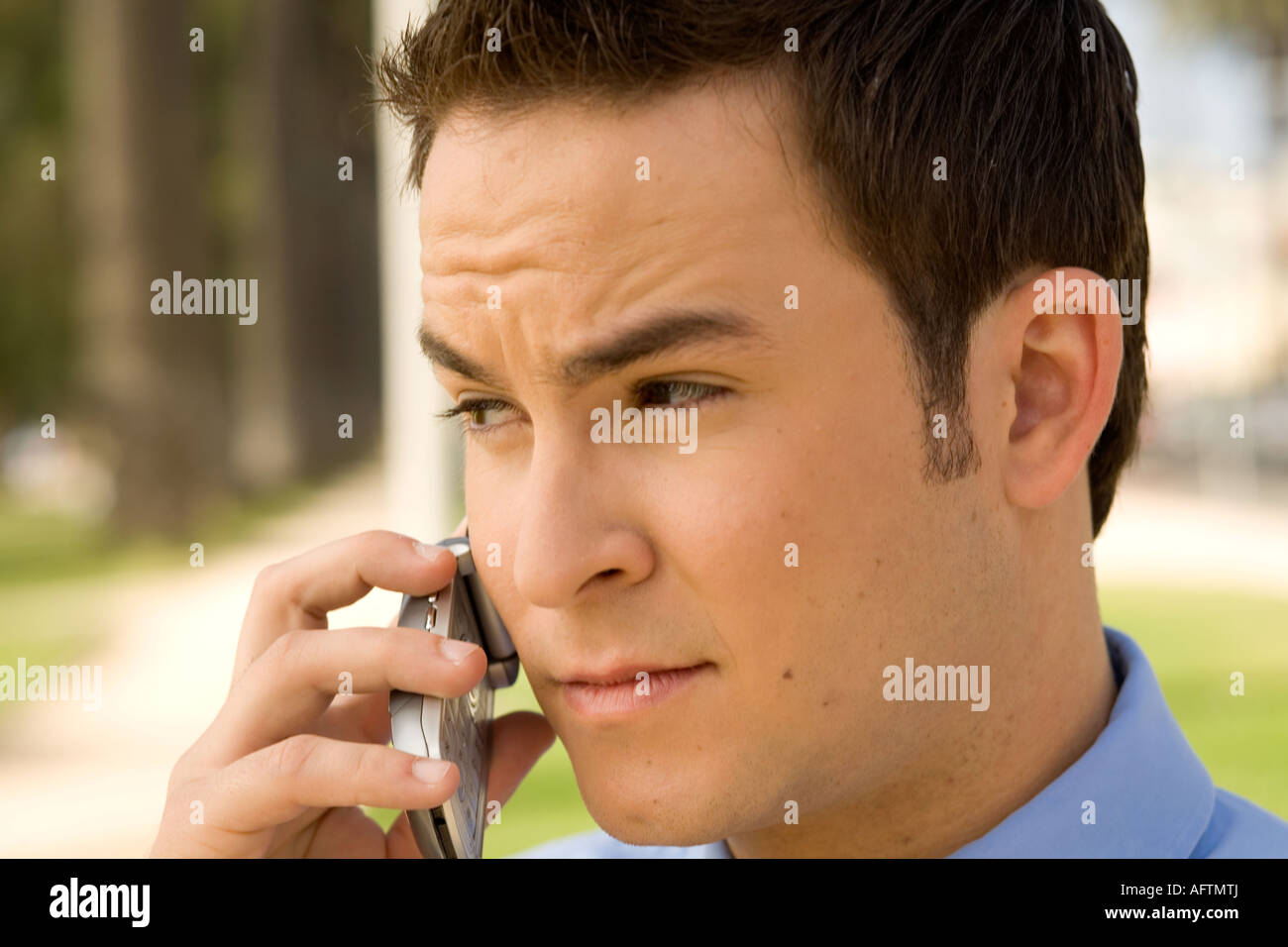 Young man using mobile phone, close up Stock Photo - Alamy