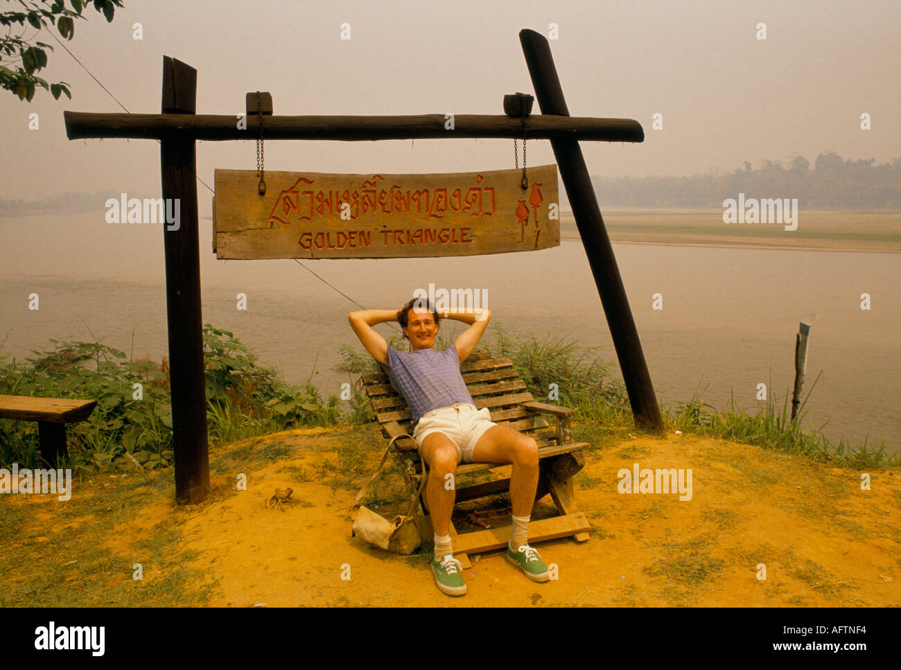 Golden Triangle Thailand. Western tourist rests under the Golden ...