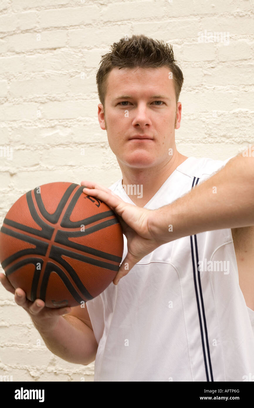 Young man holding basketball Stock Photo - Alamy Young man holding basketball Stock Photo - Alamy