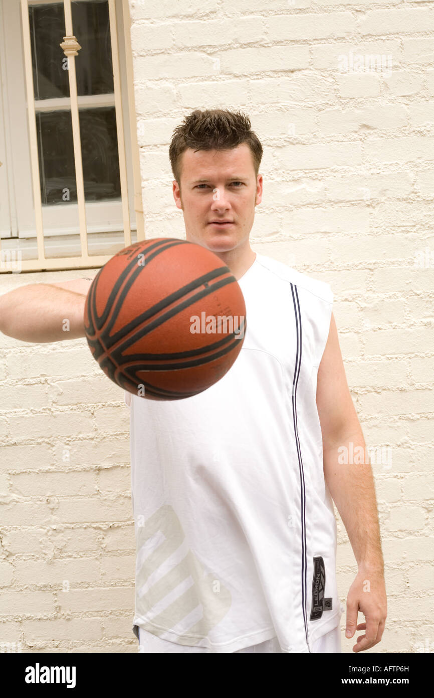 Young man holding basketball Stock Photo - Alamy Young man holding basketball Stock Photo - Alamy