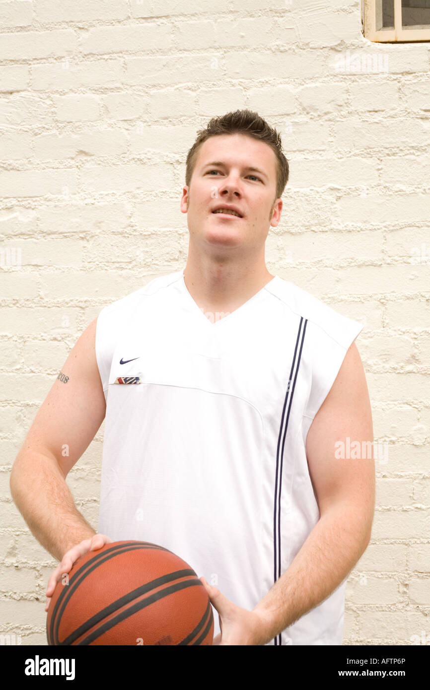 Young man holding basketball Stock Photo - Alamy Young man holding basketball Stock Photo - Alamy
