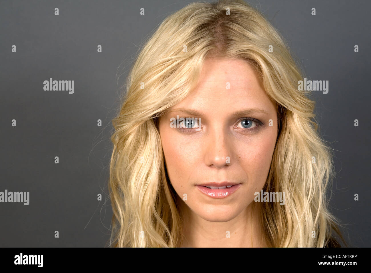 Young woman staring, close up, portrait Stock Photo - Alamy