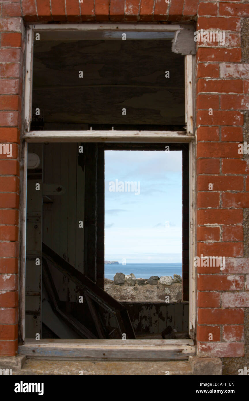 looking through broken window of old abandoned building through the ...