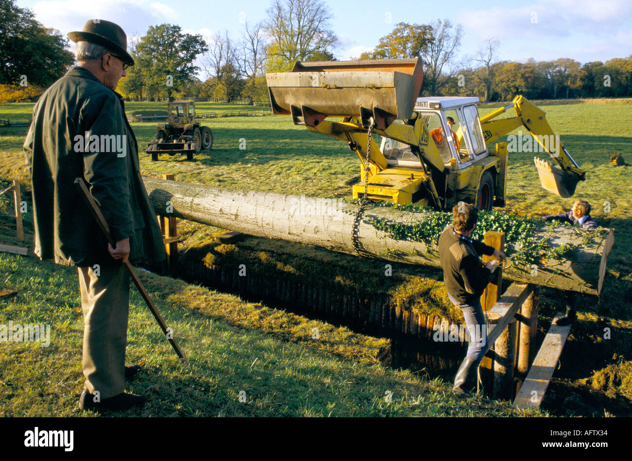Man and horse jumping a fence hi-res stock photography and images - Alamy