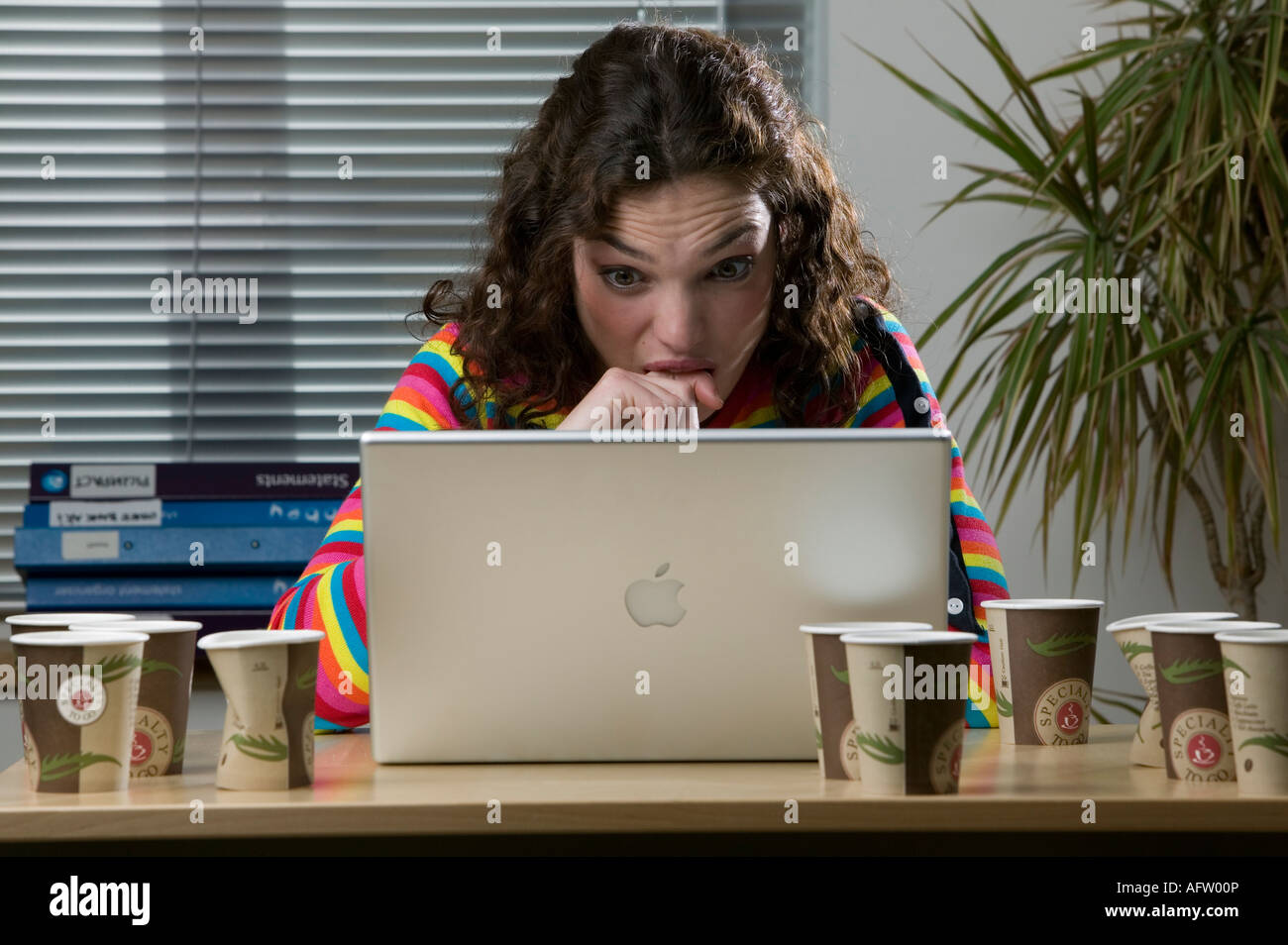 Frustrated woman biting her laptop hi-res stock photography and images ...