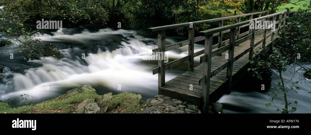 ENGLAND Cumbria Lake District National Park A wooden bridge crossing ...