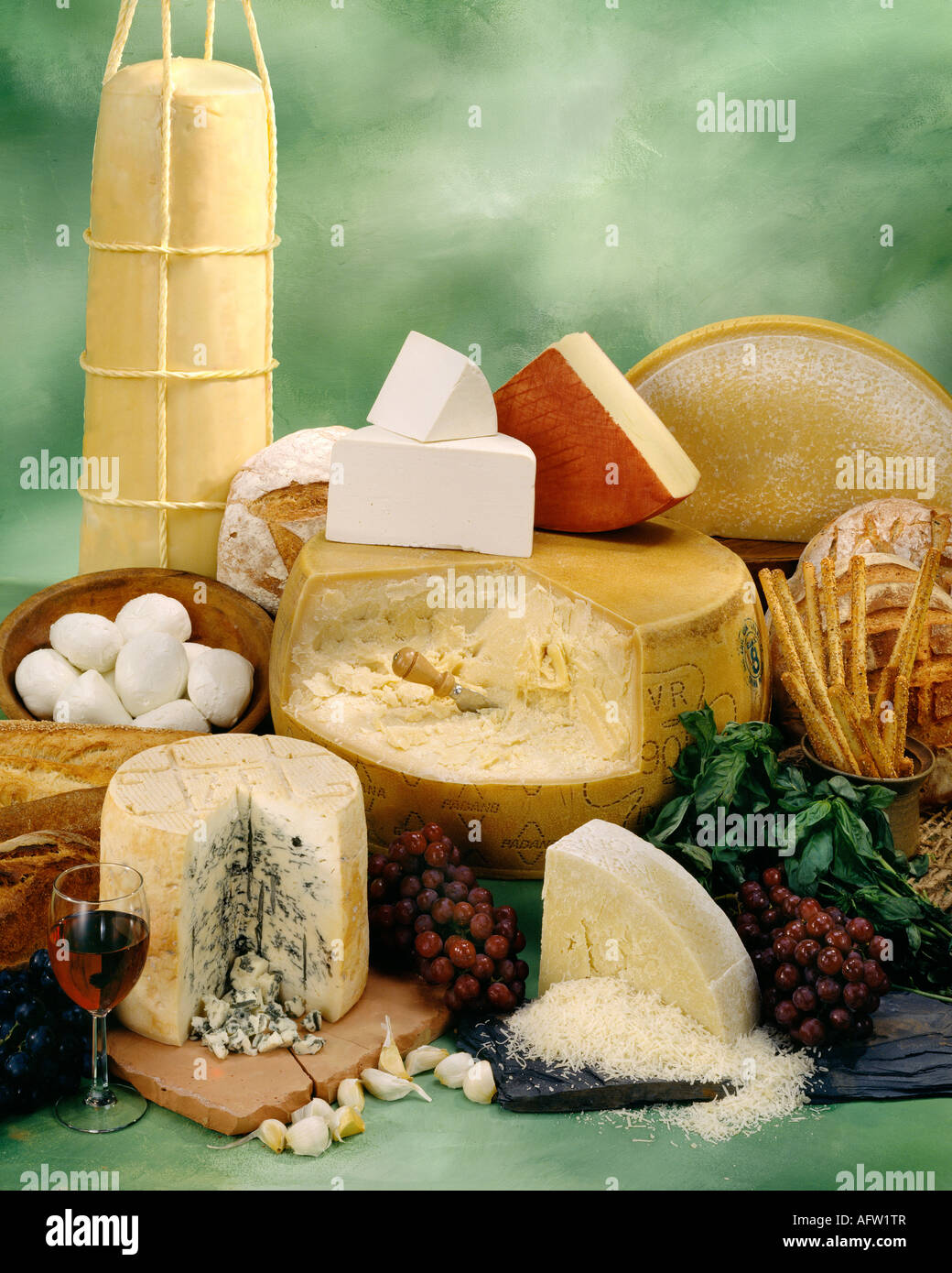 Italian Cheeses in group color photograph on green toned mottled ...