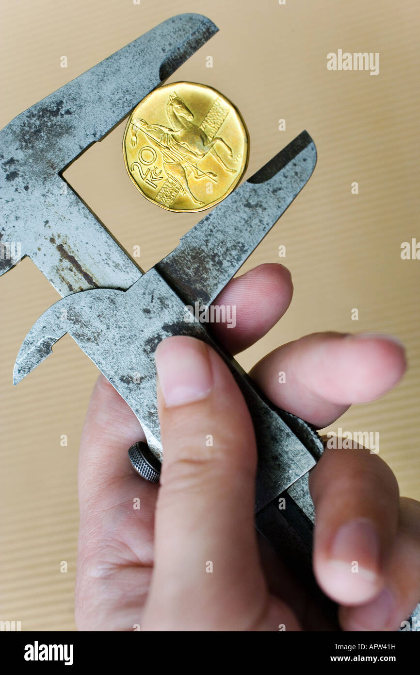 Czech coins - measuring with a caliper Stock Photo - Alamy