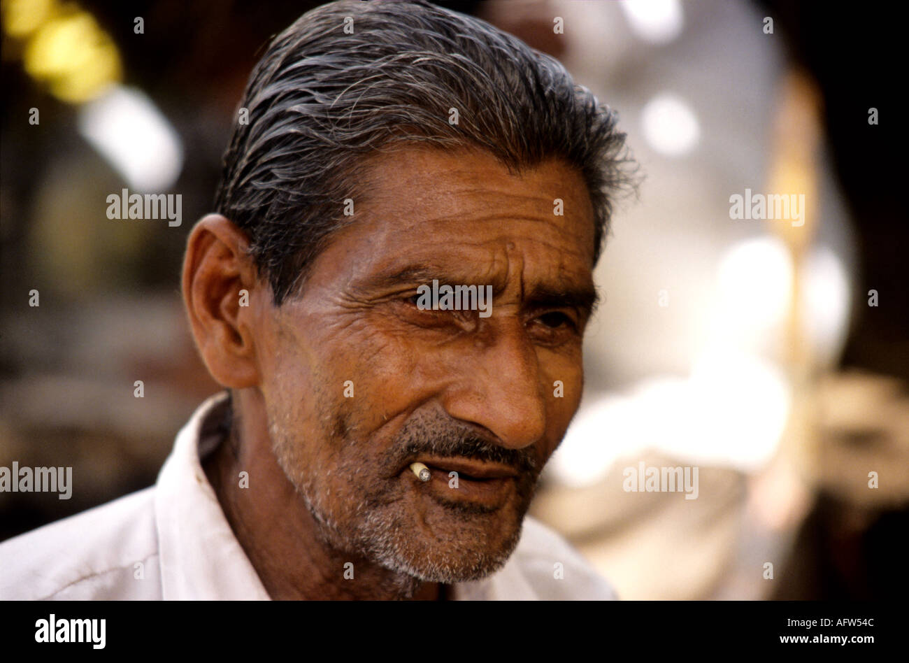 indian man smoking roll up cigarette Stock Photo - Alamy