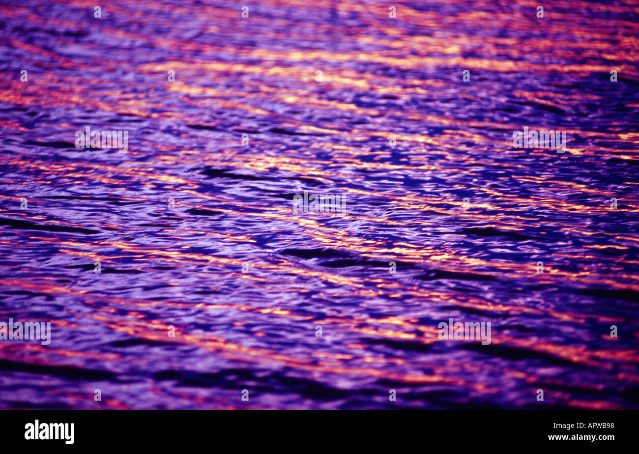Sunset colours reflected on water Stock Photo - Alamy