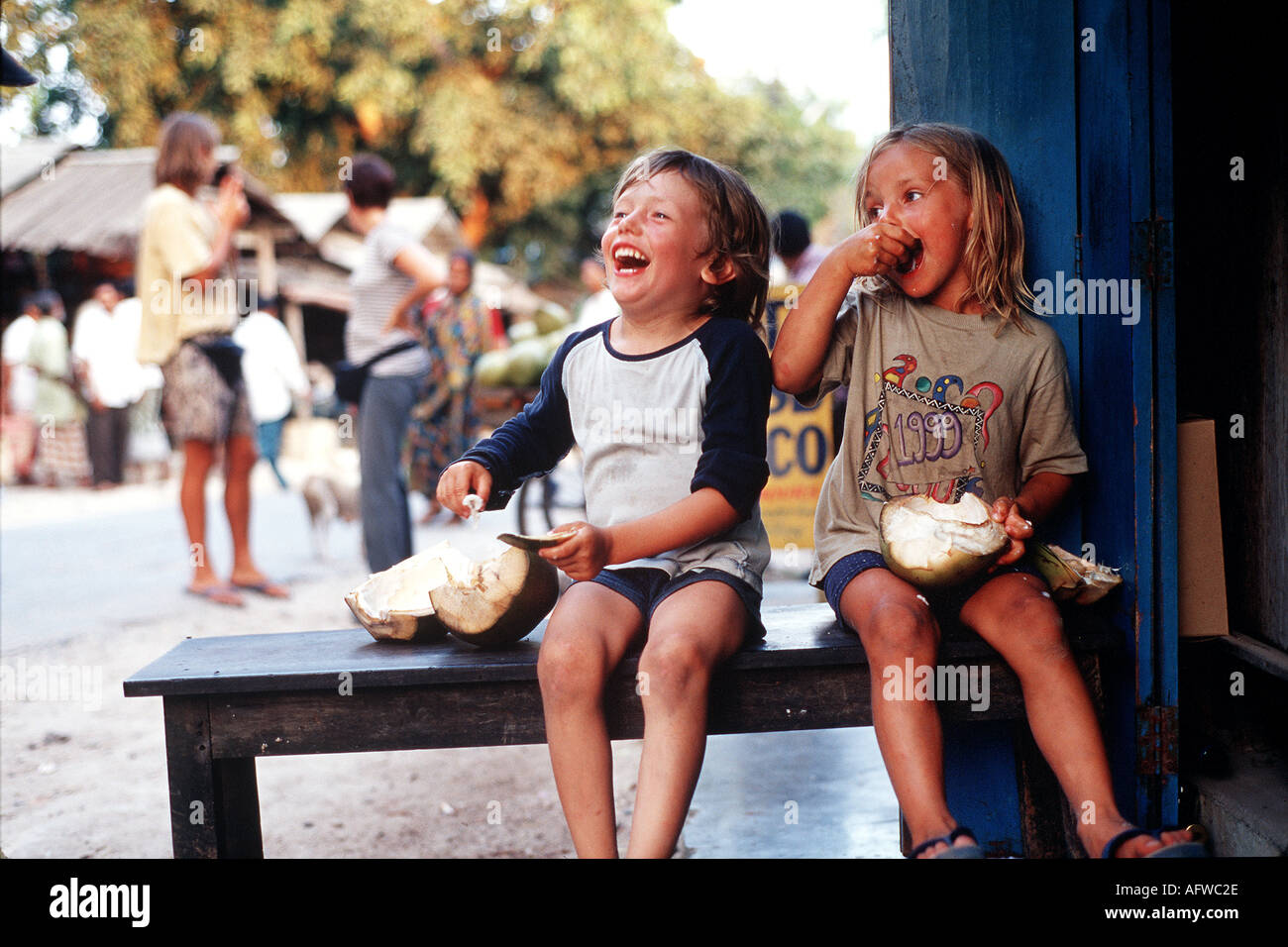 kids eating coconut and laughing in the andaman islands Stock Photo - Alamy