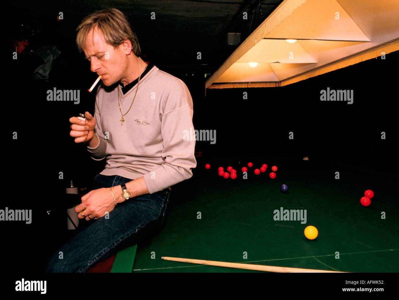 Lighting a cigarette 1980s hi-res stock photography and images - Alamy