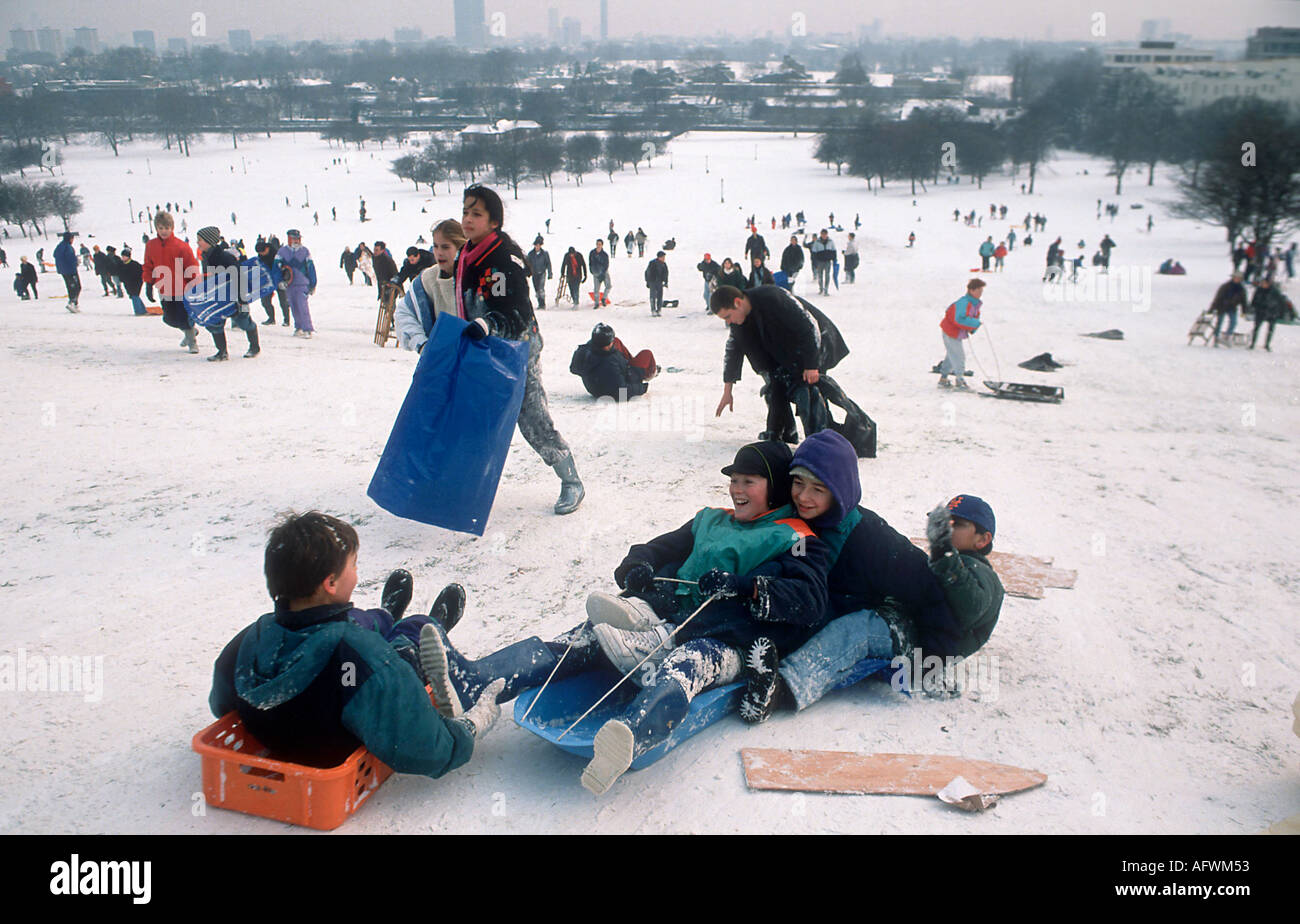 Snow UK 1990s Primrose Hill. Teenagers tobogganing winter in London ...