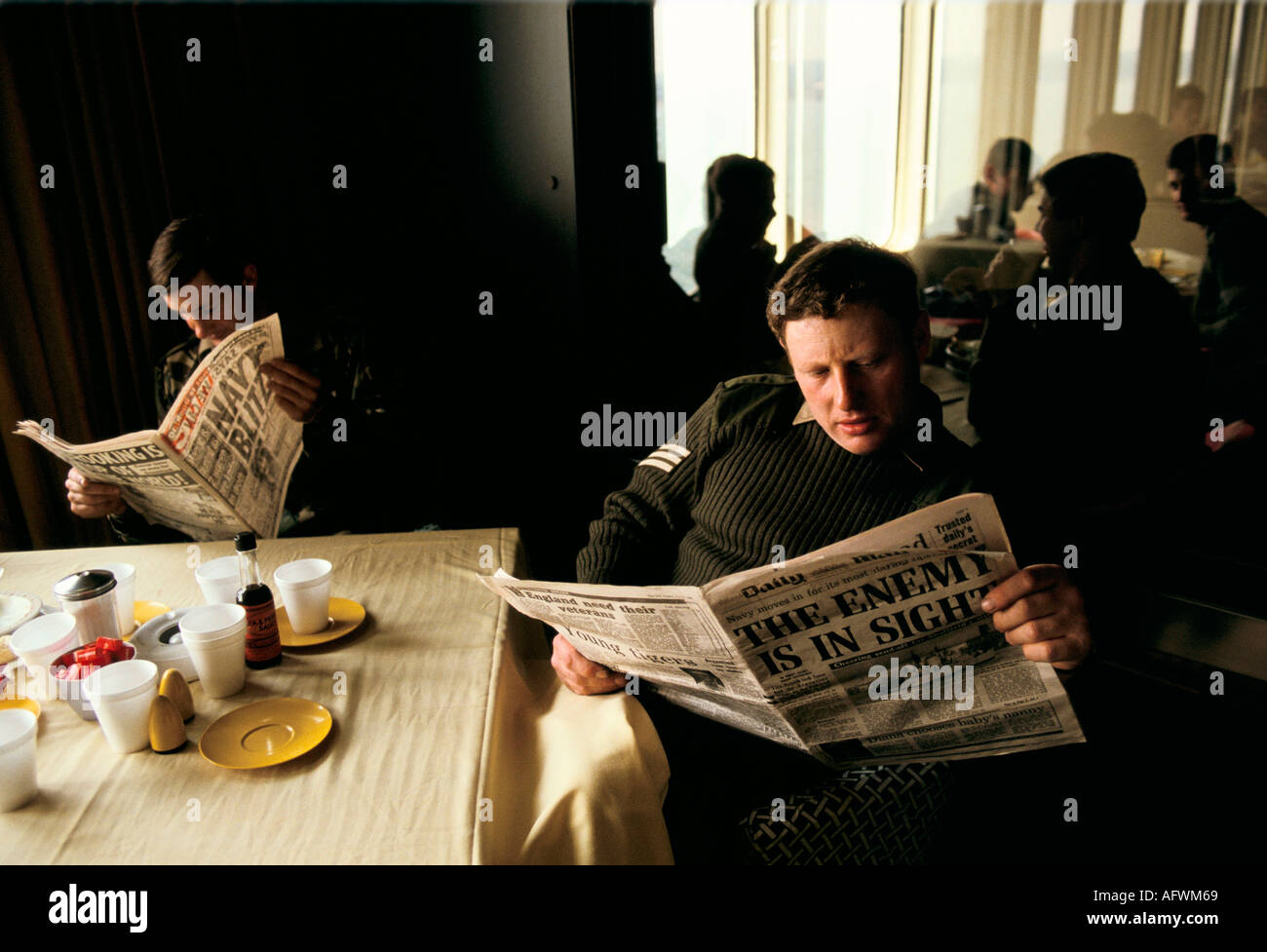 QEII QE 2 ship leaves for the Falklands May 1982. Troops reading Daily ...