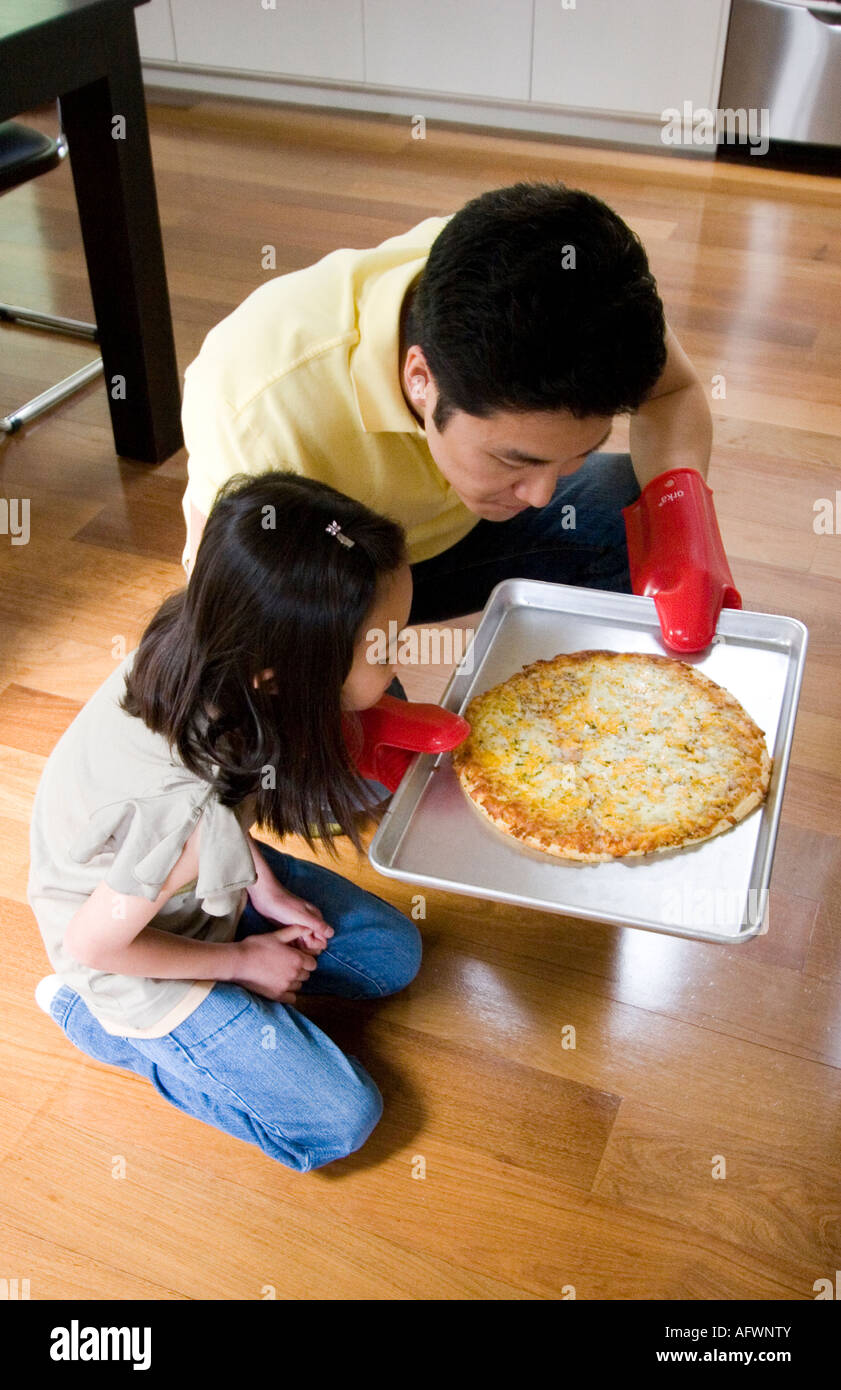 Father and Daughter Baking Pizza Stock Photo - Alamy