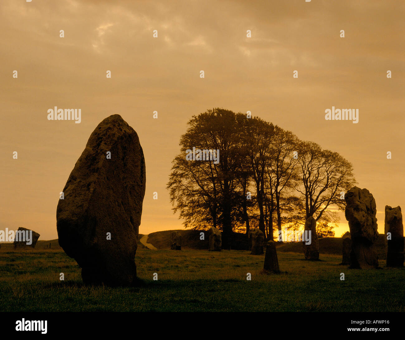 Avebury Standing Stones, Wiltshire UK. The sun rises at dawn over ...