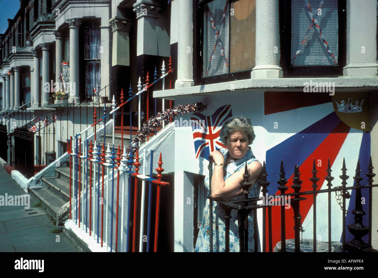 Queen Elizabeth II Silver Jubilee East End London. A woman outside her ...