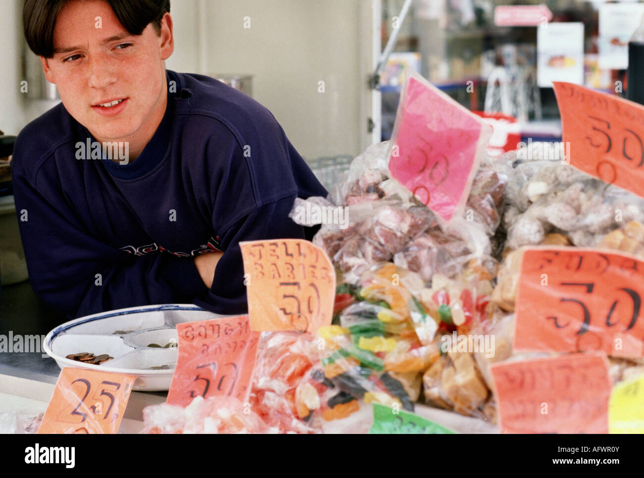Young Man selling sweeties London UK Stock Photo - Alamy