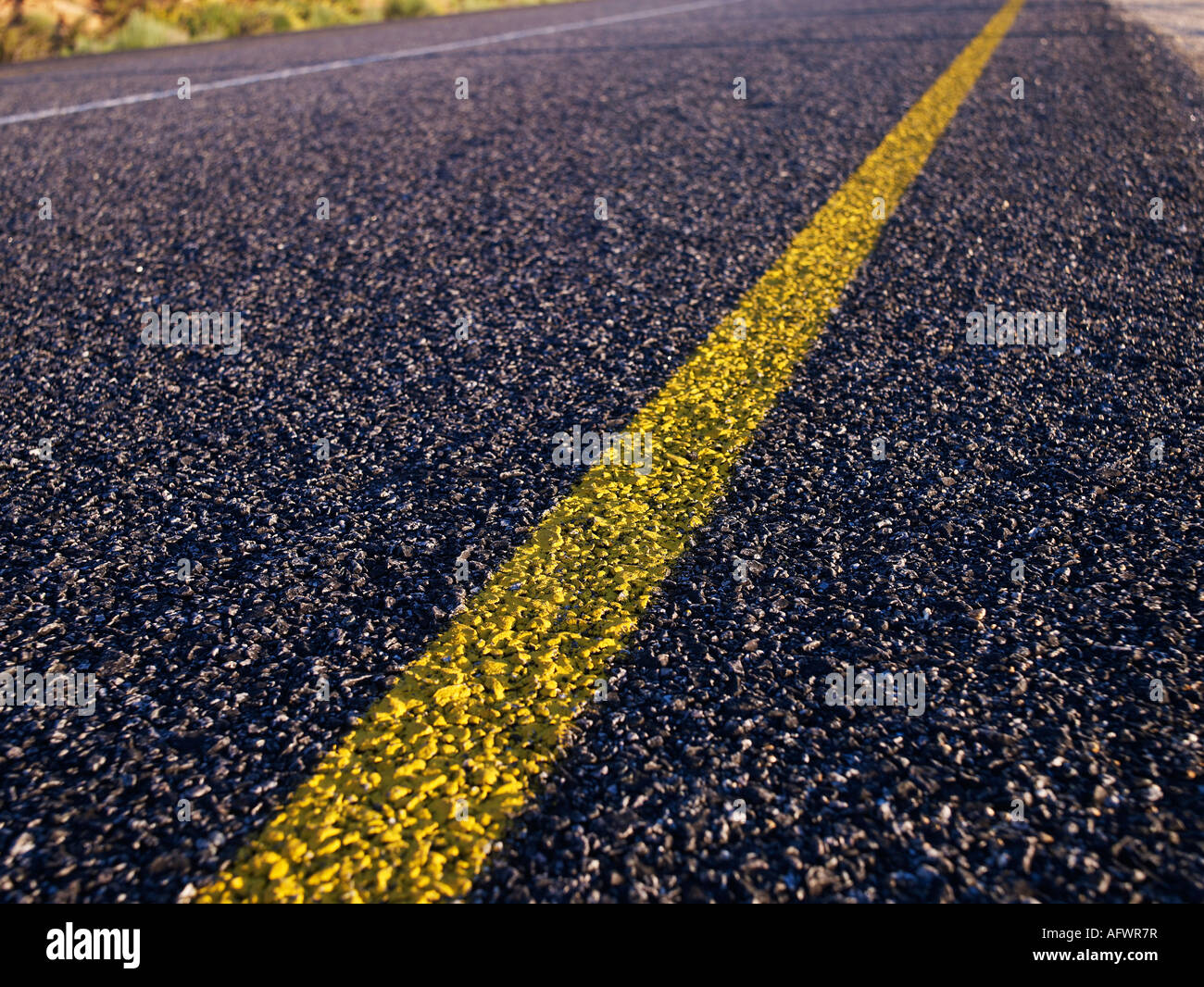 yellow street mark on asphalt Stock Photo - Alamy