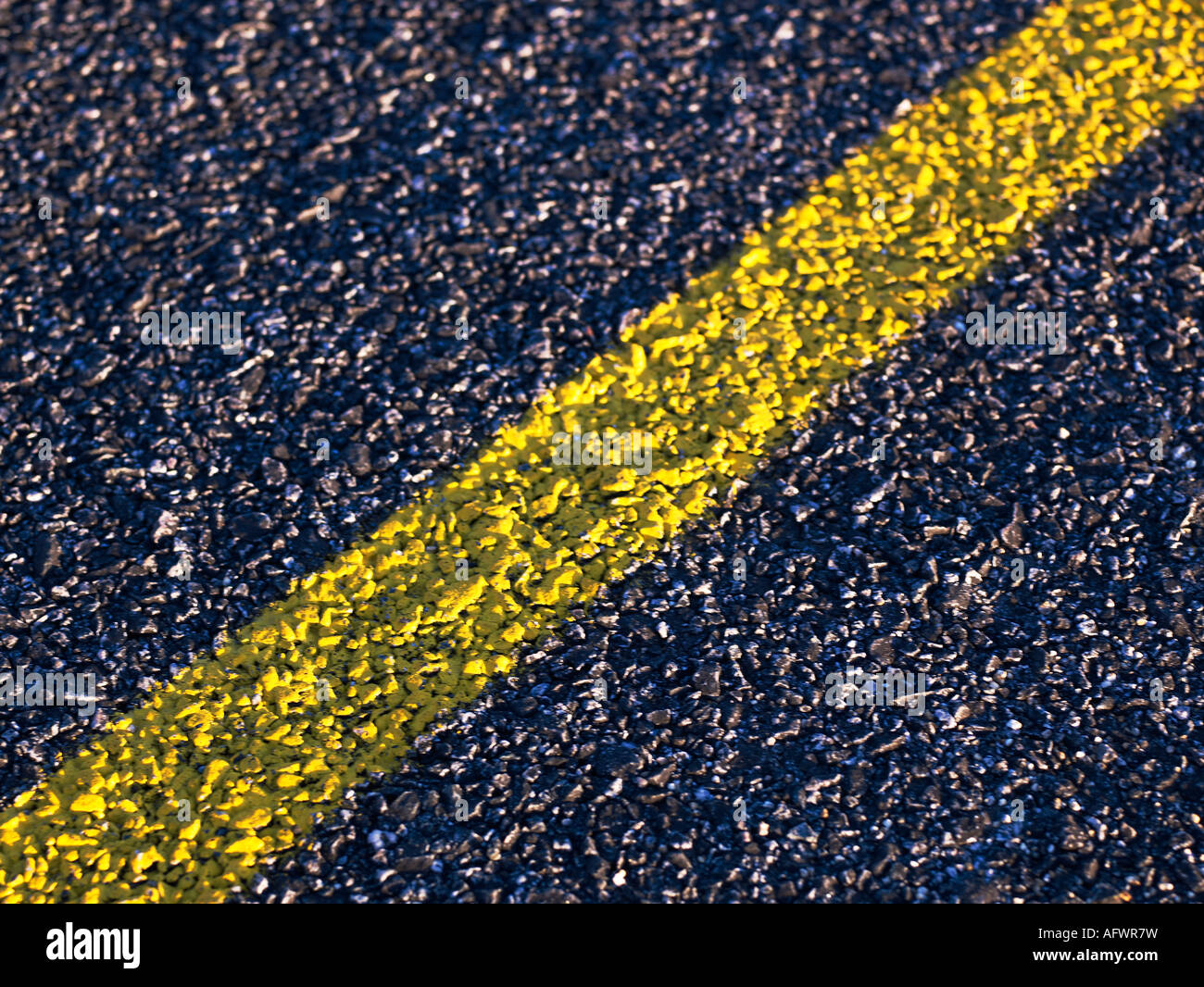 yellow street mark on asphalt Stock Photo - Alamy