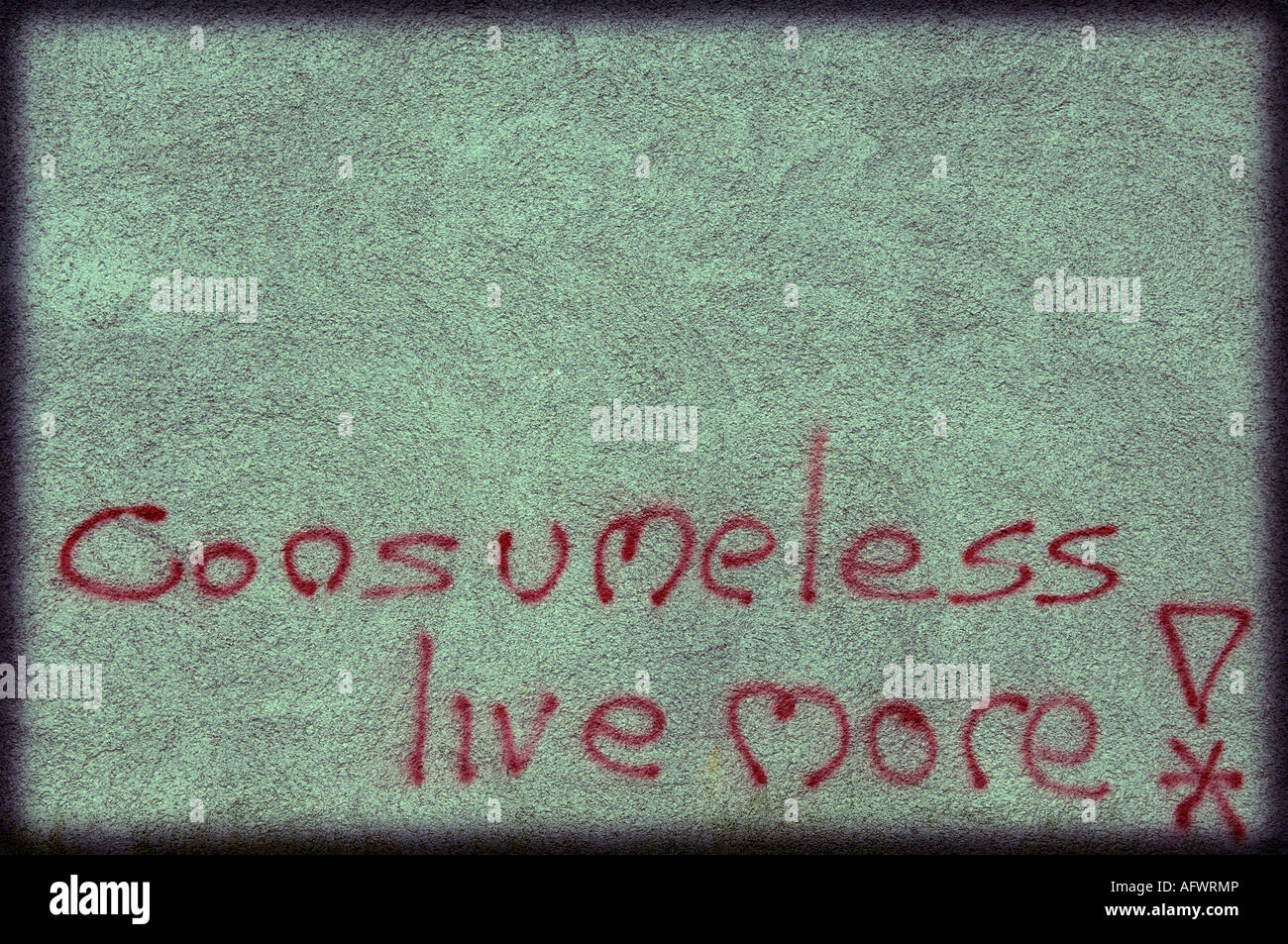 consume less live more graffiti wall Stock Photo - Alamy