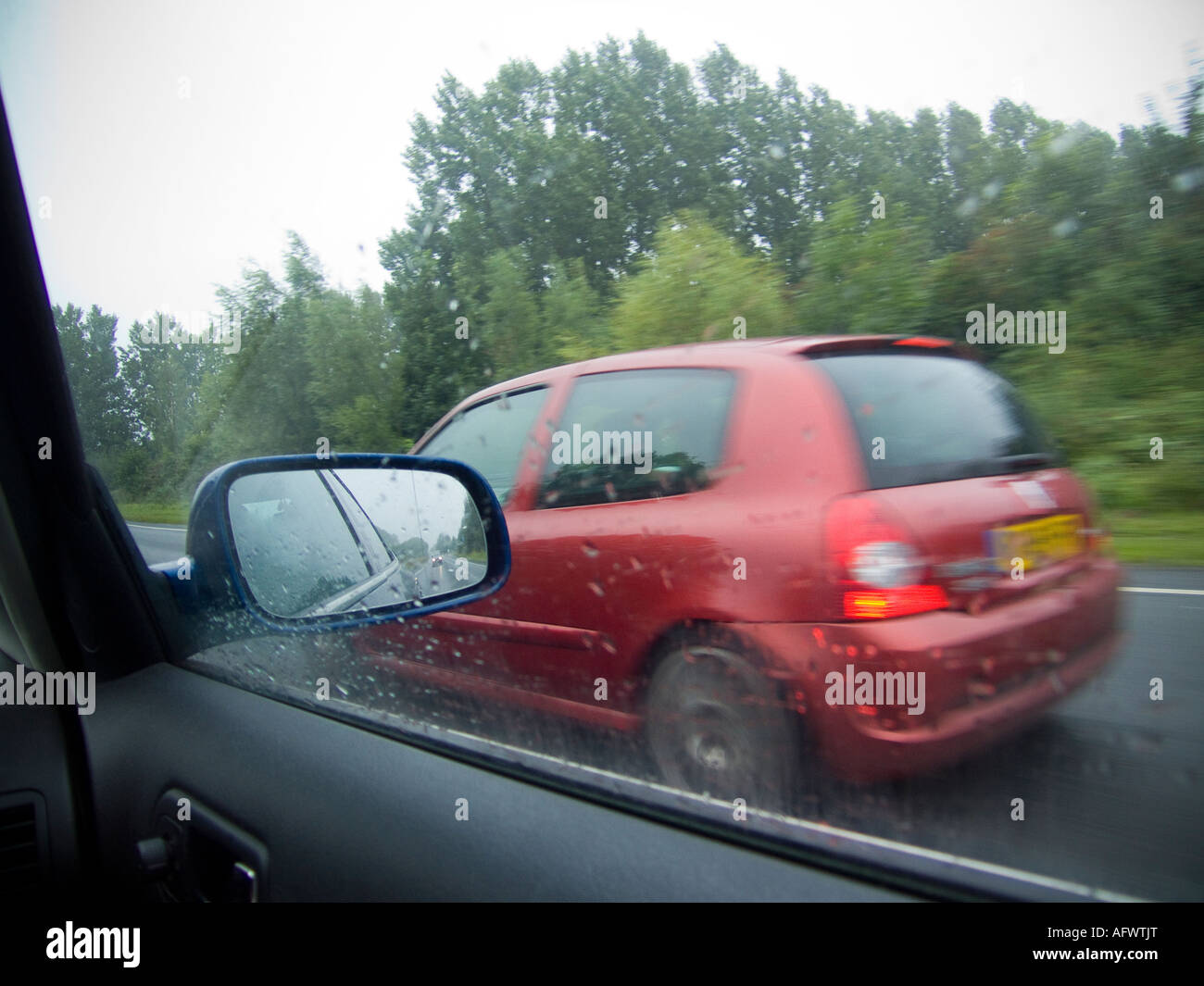 Car driver(boy racer) overtaking on a country road Stock Photo - Alamy