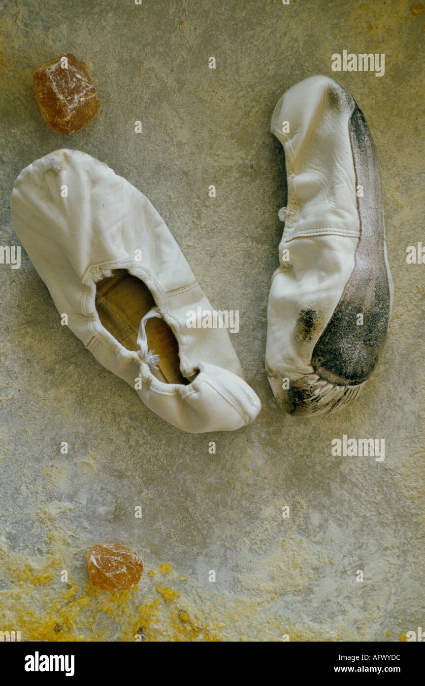 Ballet shoes a pair, old used worn out discarded left on the floor. UK ...