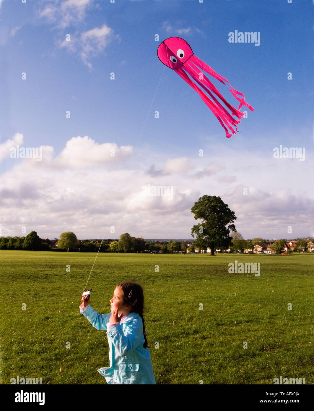 child flying a kite Stock Photo - Alamy