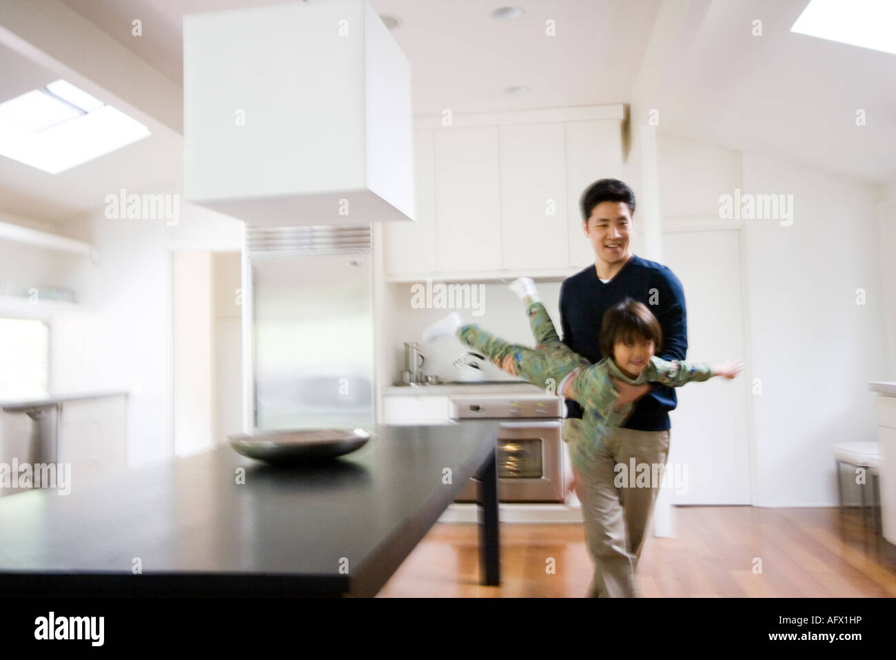 Father and son pretending to fly hi-res stock photography and images ...
