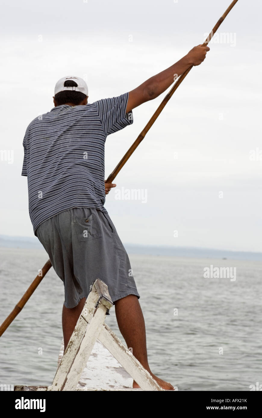 Philippines Backside View Of Young Filipino Man Pushing Outrigger Boat ...