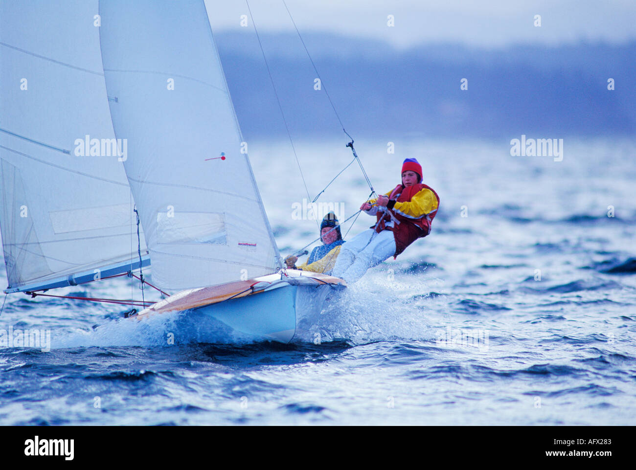 Two women sail a 505 class boat on Puget Sound in the winter Stock ...
