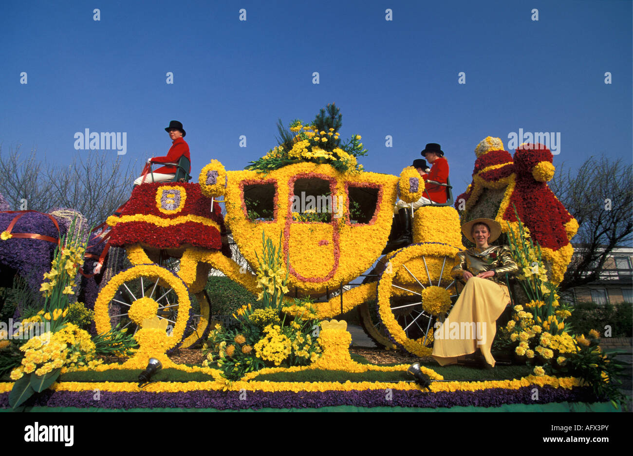 Netherlands Lisse People sitting on coach decorated with flowers during ...