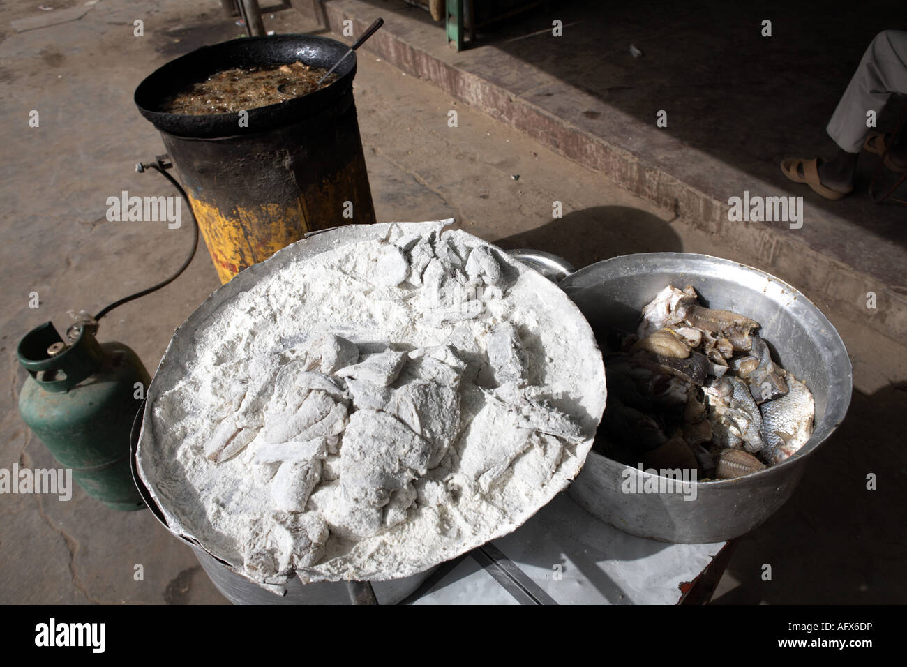 Cooking fish in Dongola, Sudan Stock Photo - Alamy