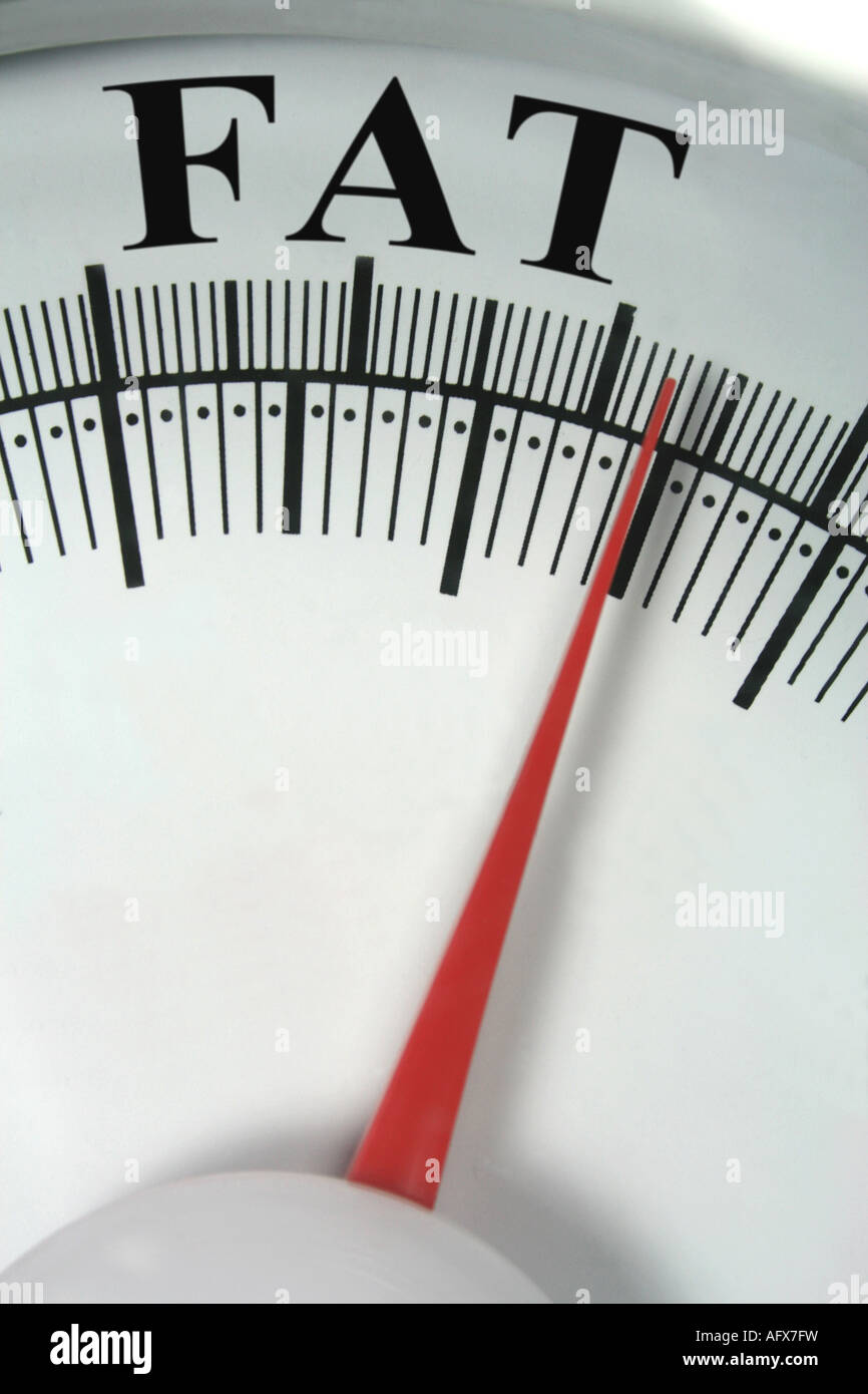 bathroom scales indicating fat Stock Photo - Alamy