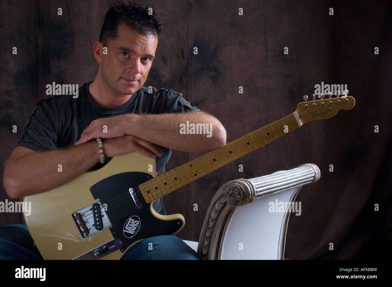 40 year old male musician holding iconic blonde fender telecaster ...