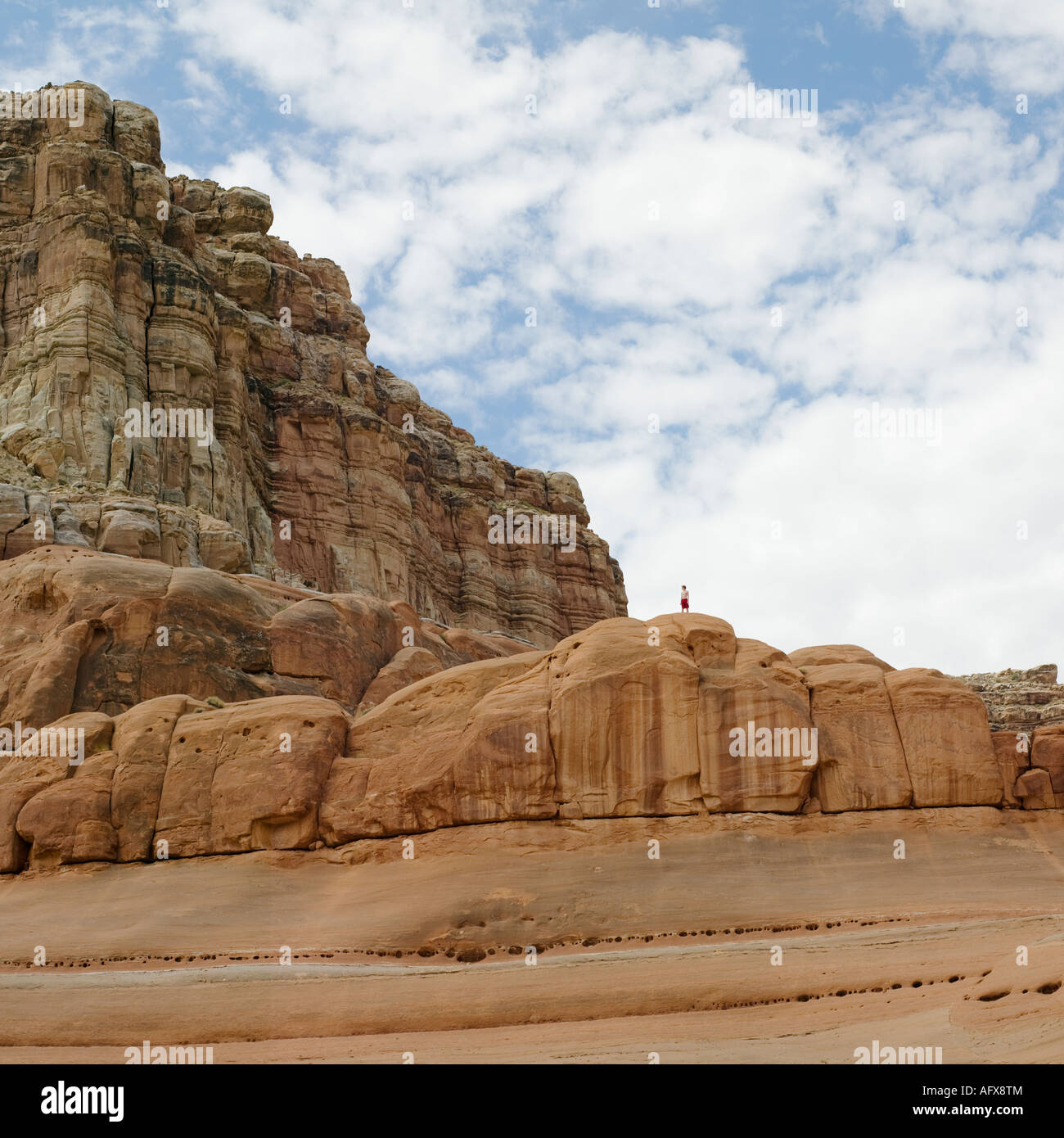 Single person standing atop rock formation, Lake Powell, Utah Stock ...